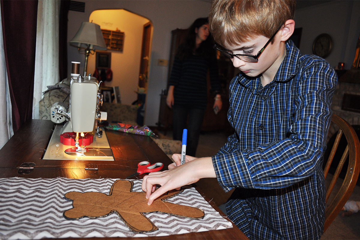 Young Boy Sews Bears for Children in Need